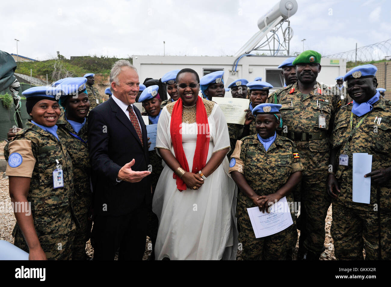 SRSG Michael Keating and DSRCC Lydia Wanyoto Mutende pose for a group ...