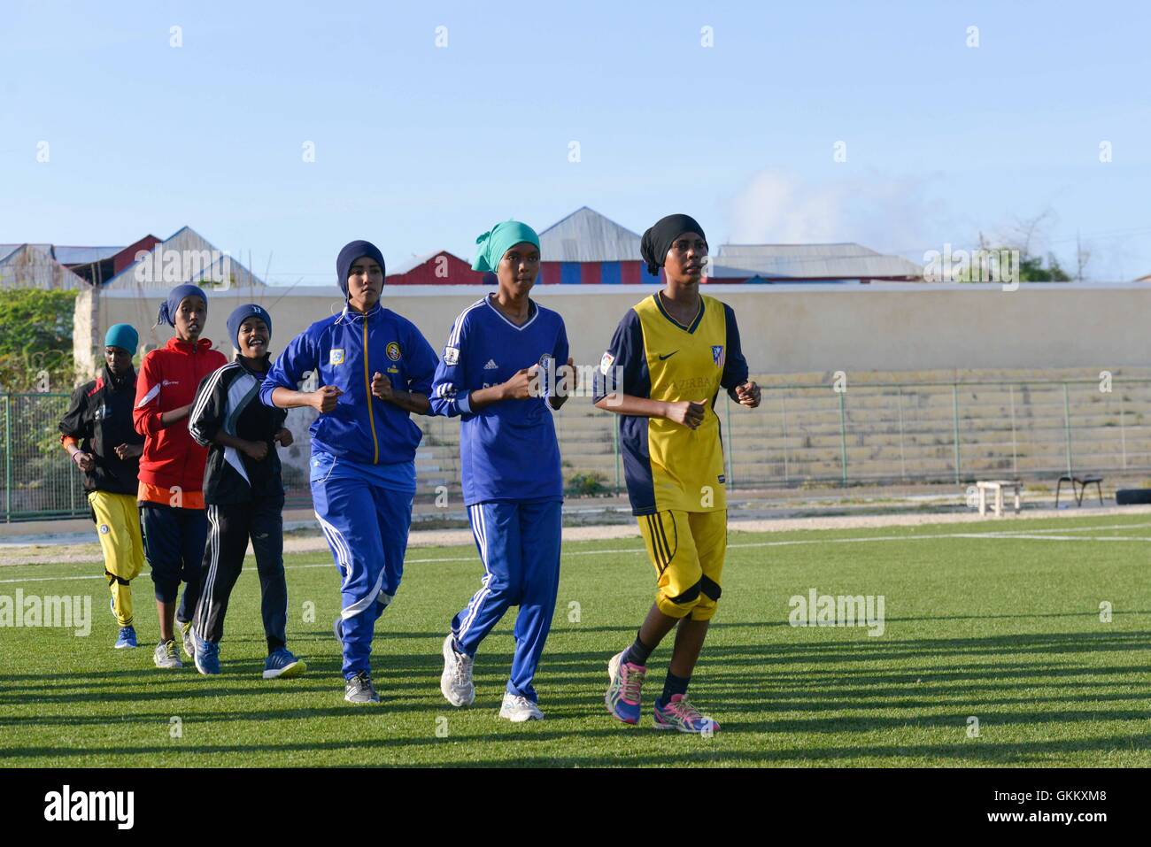 Somali female athletes jog during a training session at Banadir Stadium ...