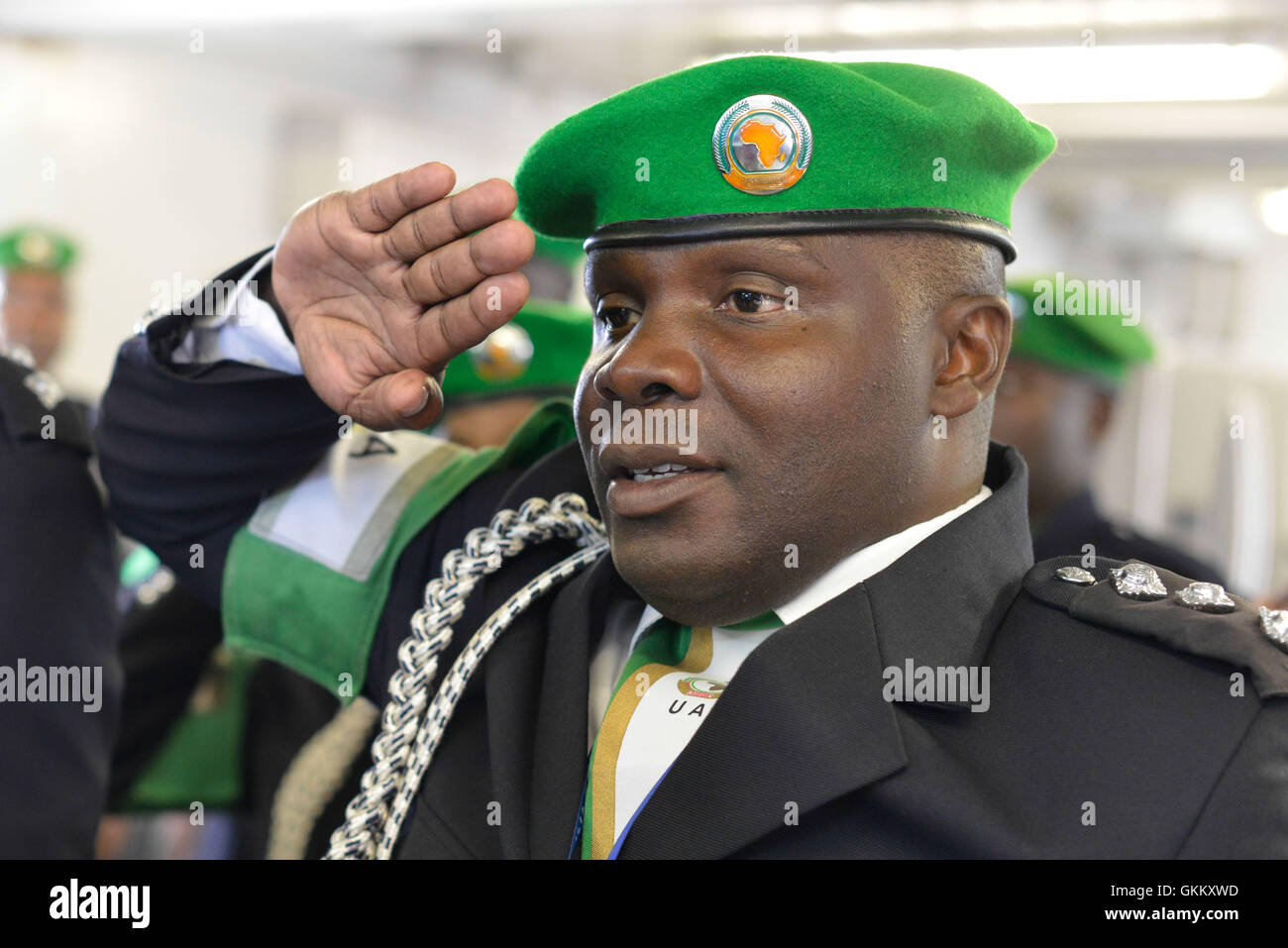 AMISOM police officers salute during the farewell ceremony for Ugandan ...
