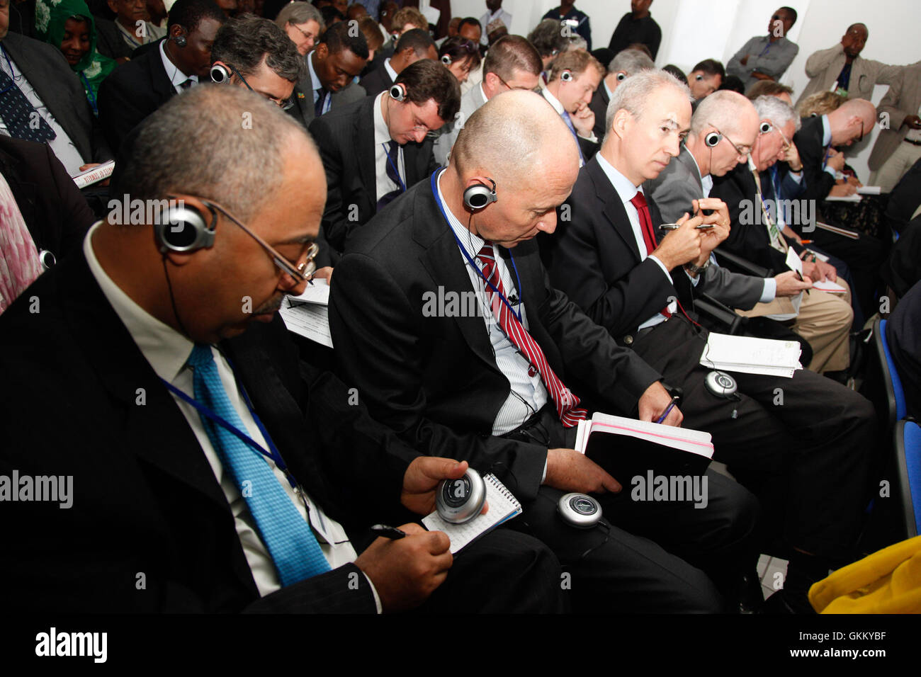 Delegates listen attentively during an event or meeting. The image ...