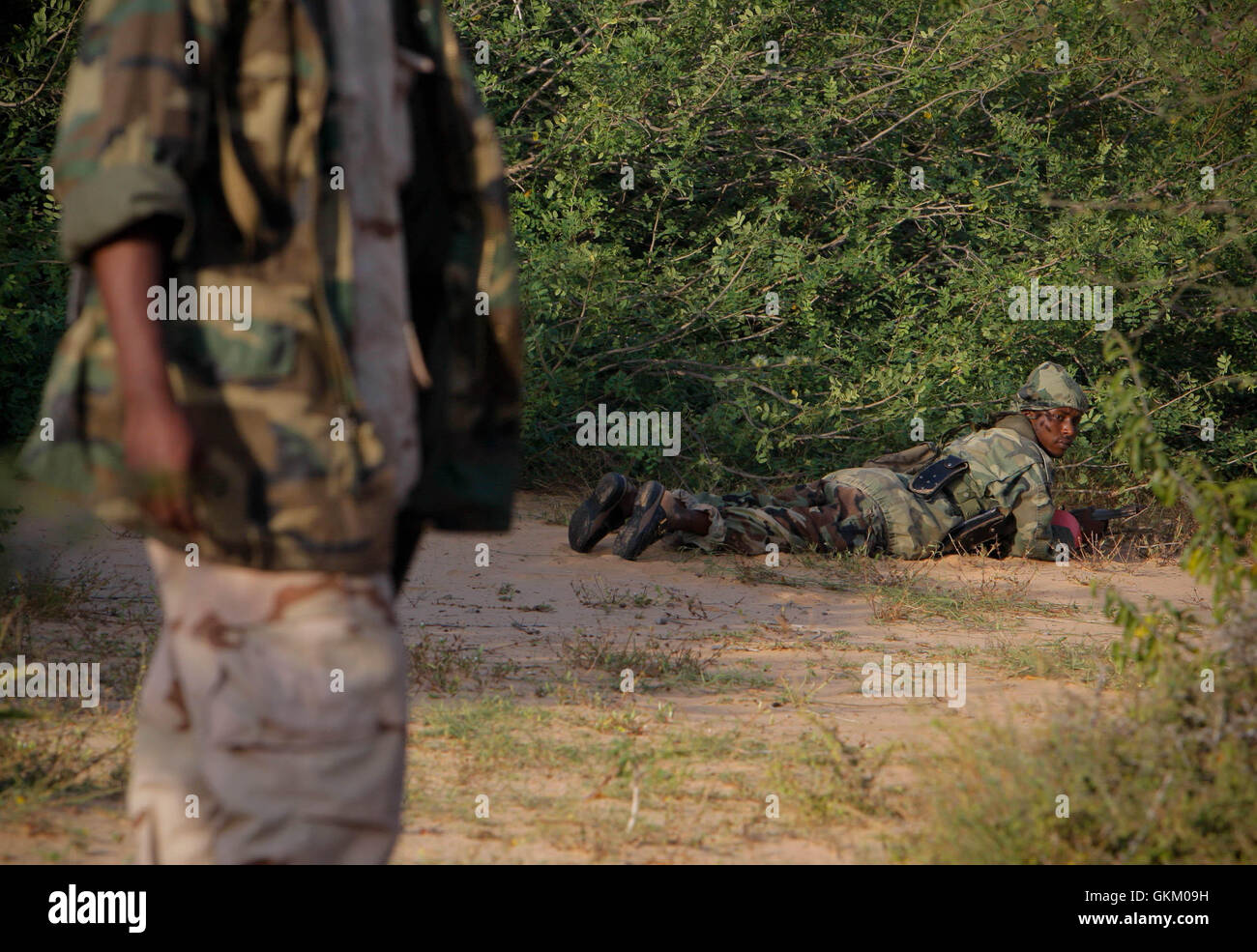 A Somali National Army (SNA) soldier assumes a firing position during ...