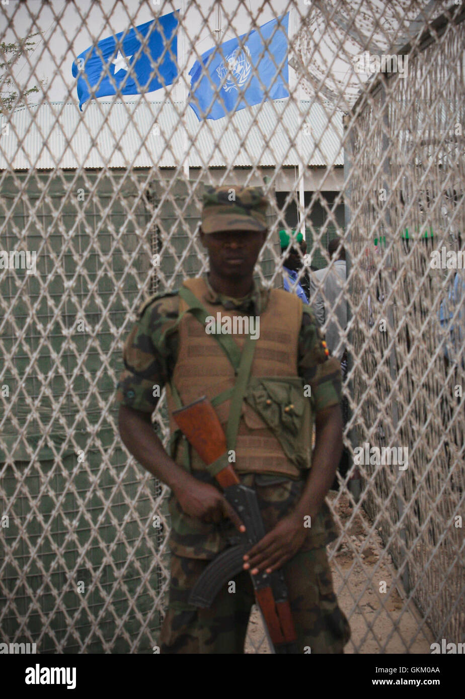 On January 24, a Ugandan soldier serving with AMISOM stands in front of ...