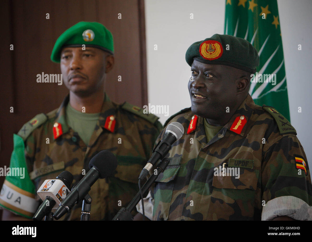 Incoming AMISOM Force Commander Lt. Gen. Andrew Gutti, flanked by ...