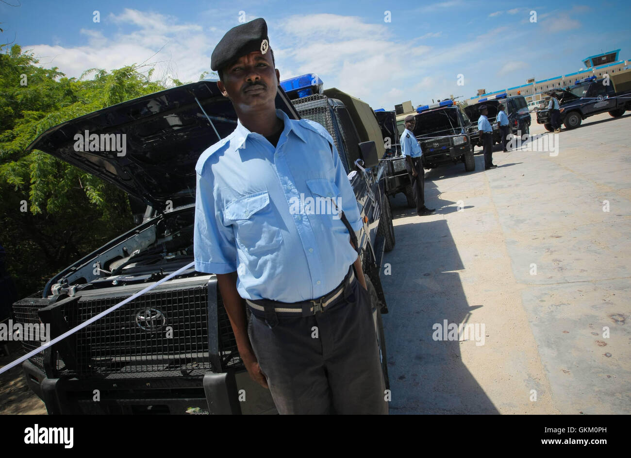 An officer of the Somali Police Force (SPF) stands in front of newly ...