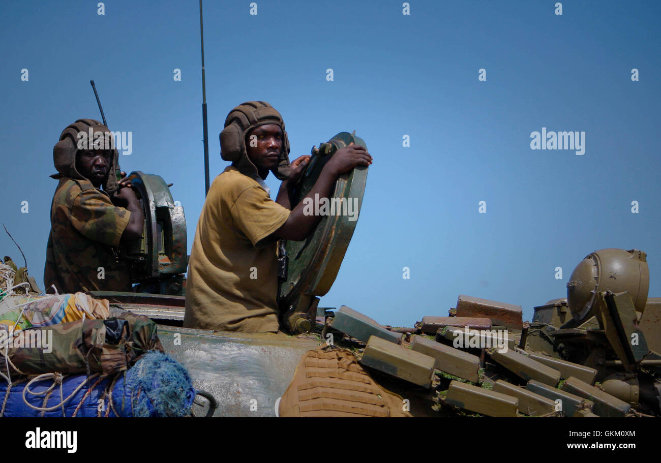 A Ugandan tank crew, part of AMISOM, holds position on the outskirts of ...