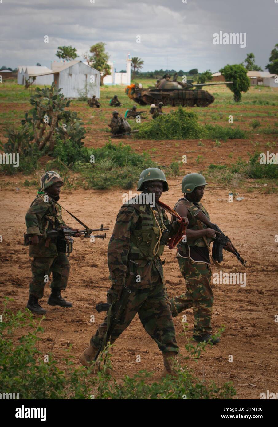 On May 25, Ugandan soldiers of the 09 Battalion, AMISOM, advance ...