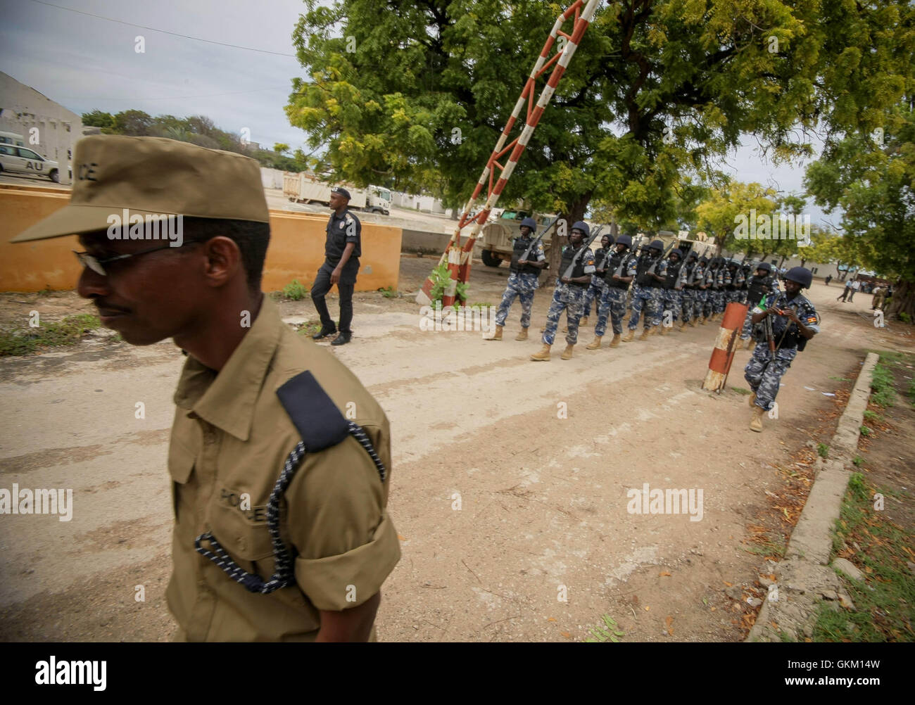 On August 7, 2012, a Somali Police Officer leads Ugandan officers from ...