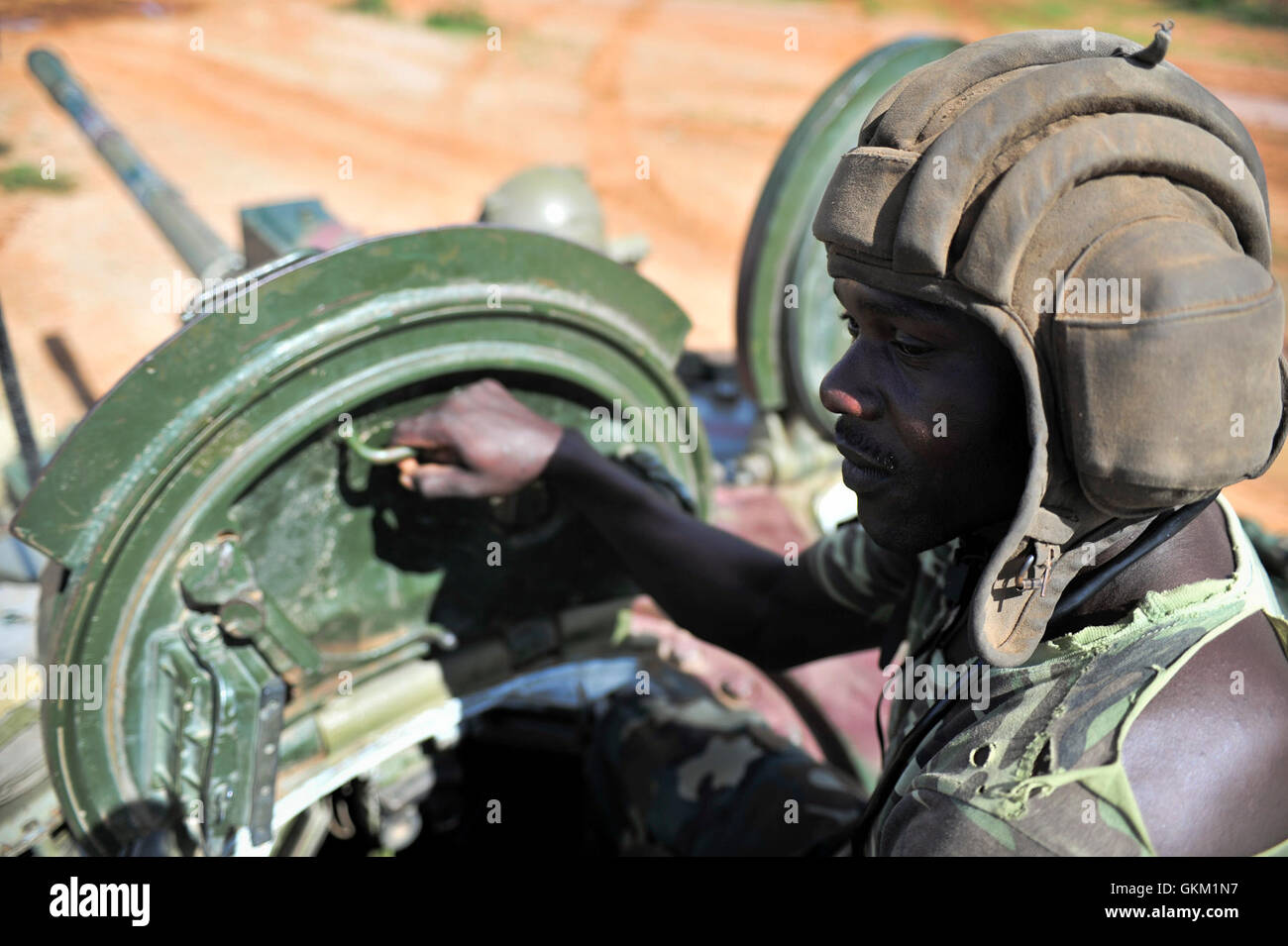 A Ugandan soldier prepares for a convoy as part of AMISOM's operations ...