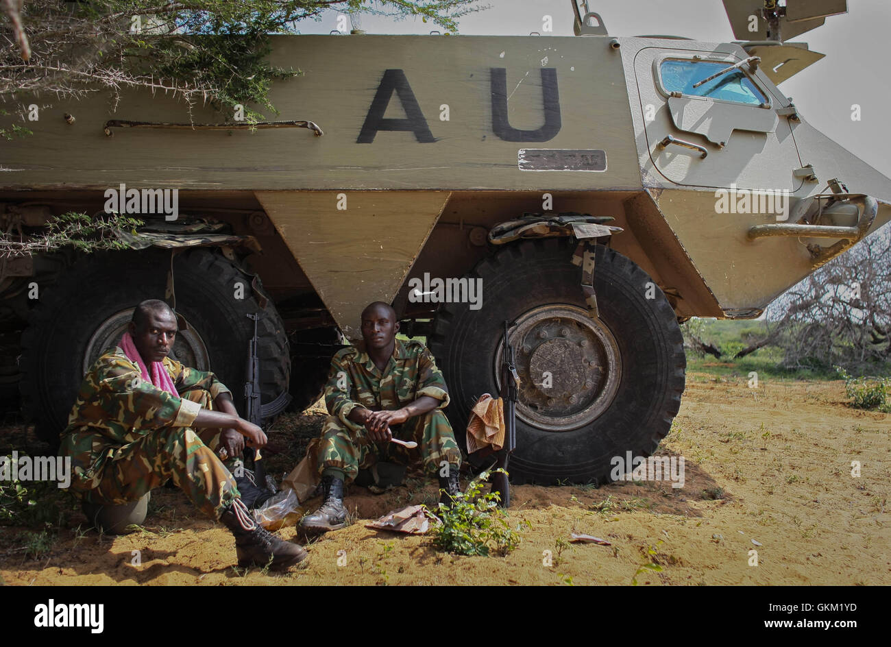 Burundian troops with AMISOM rest next to a vehicle after a ground ...