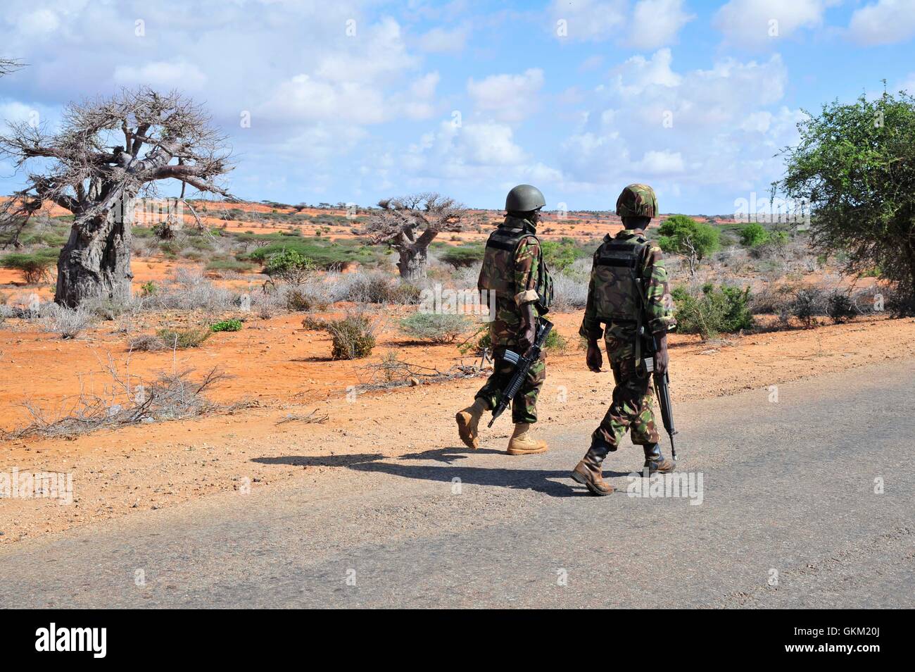 Soldiers patrol the road between Kismayo International Airport and the ...