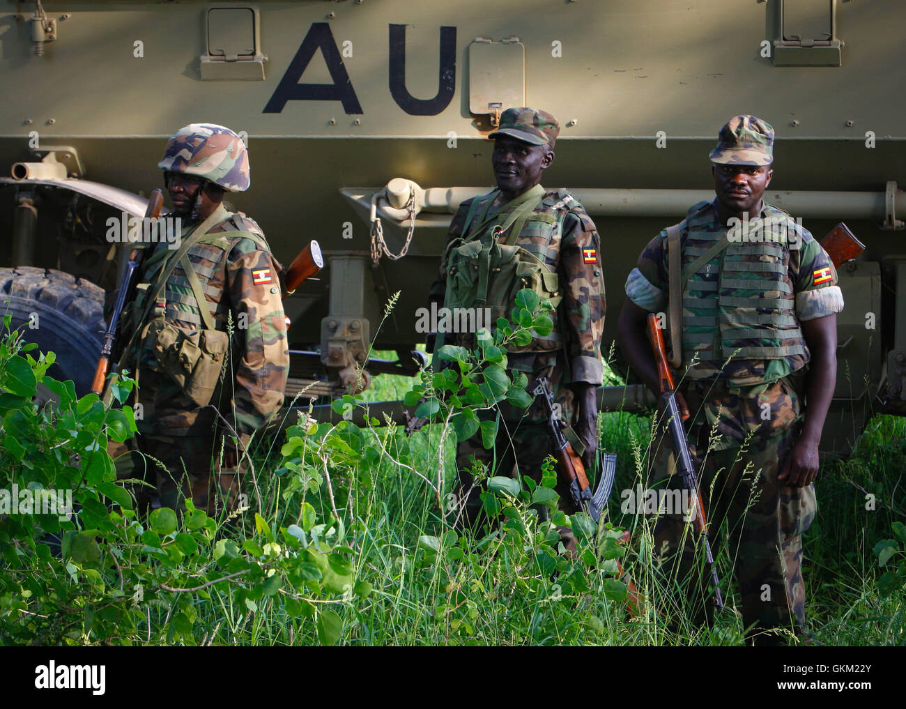 Ugandan soldiers serving with AMISOM stand in front of a fighting ...
