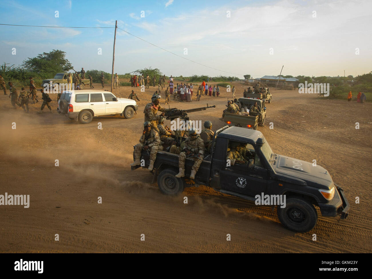 Somali National Army (SNA) soldiers, supported by AMISOM, drive through ...