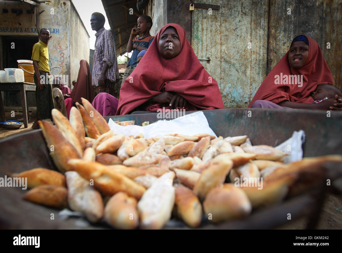 A Somali woman is seen selling bread in a market in Jawahar, Middle ...