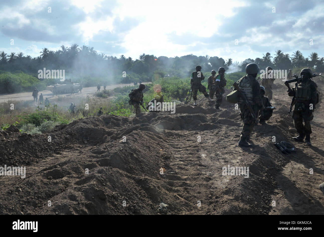 Ugandan and Somali National Army (SNA) troops pause during their ...