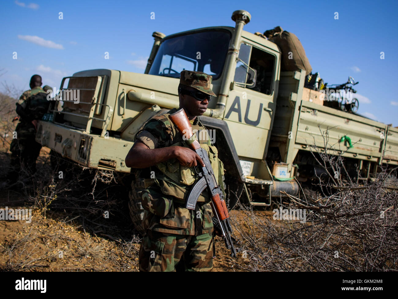 A Ugandan soldier of AMISOM stands in front of a truck in Buur-Hakba ...
