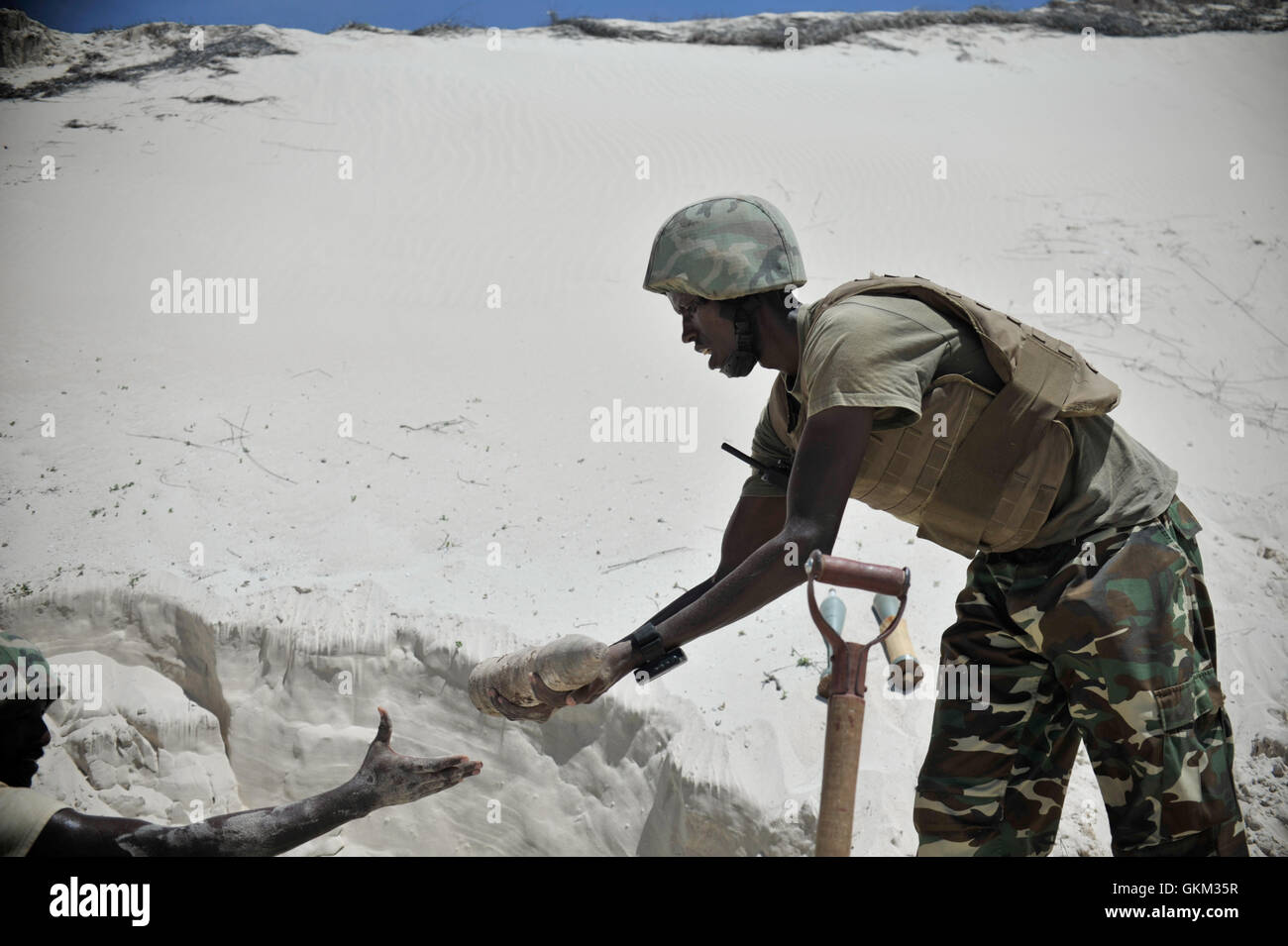 On May 9, a team, assisted by the UN Somalia Mine Action agency, places ...