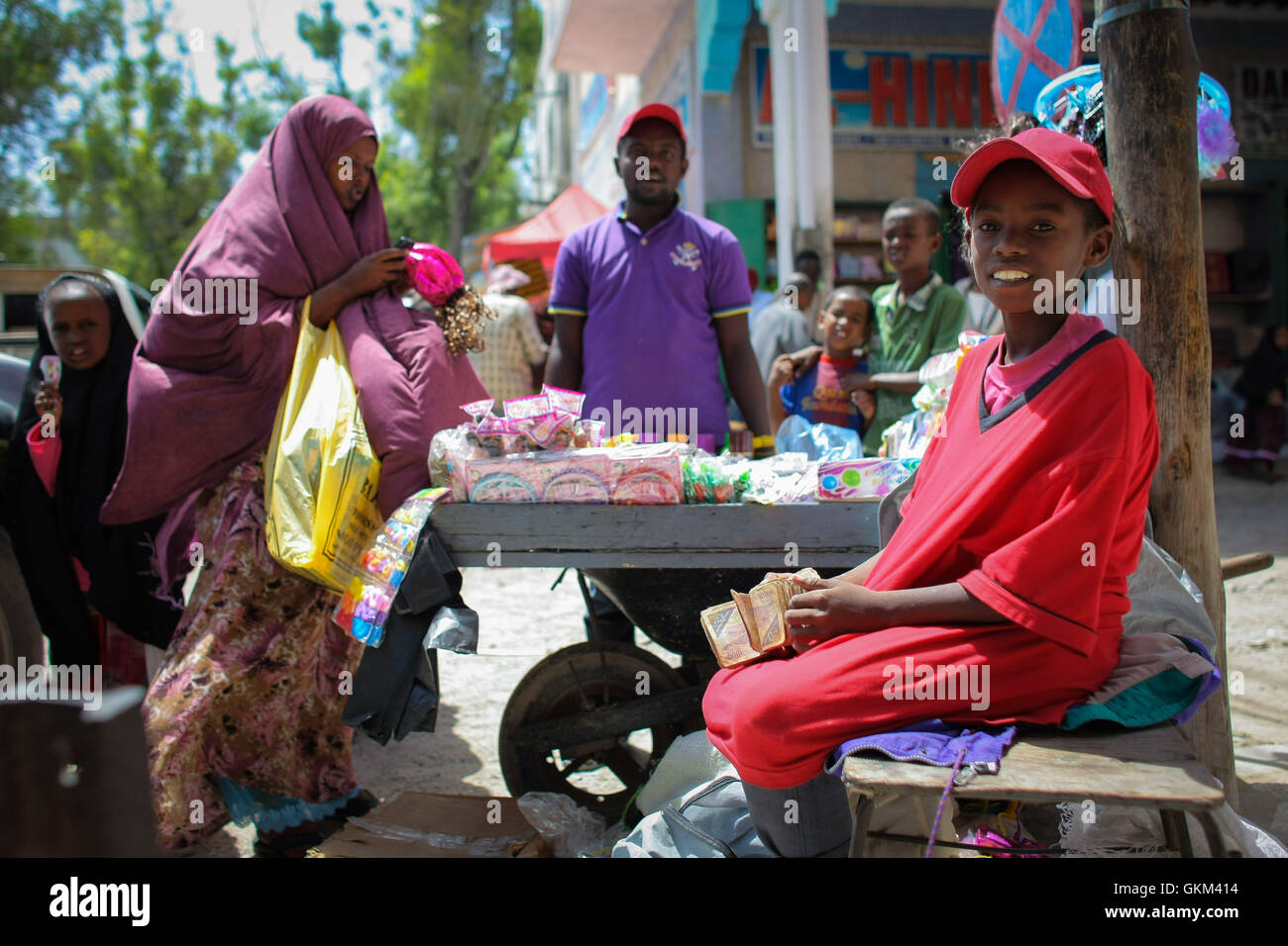 A woman shops at a roadside stall in the Hamar Weyne market in ...