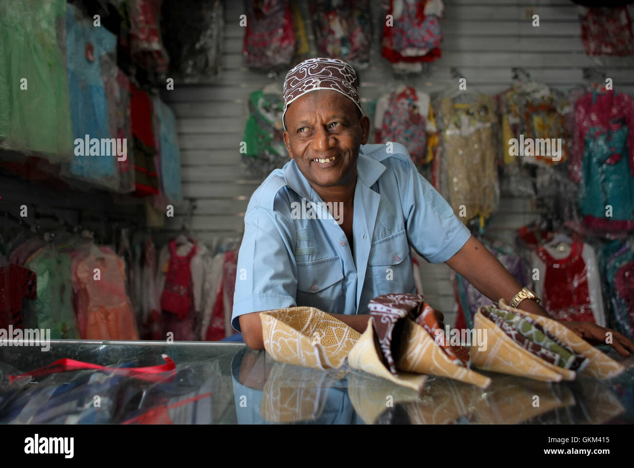 A shopkeeper stands in his clothing and footwear shop at Hamar Weyne ...