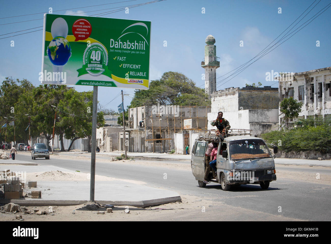 A commuter taxi drives through the Boondheere district of Mogadishu on ...