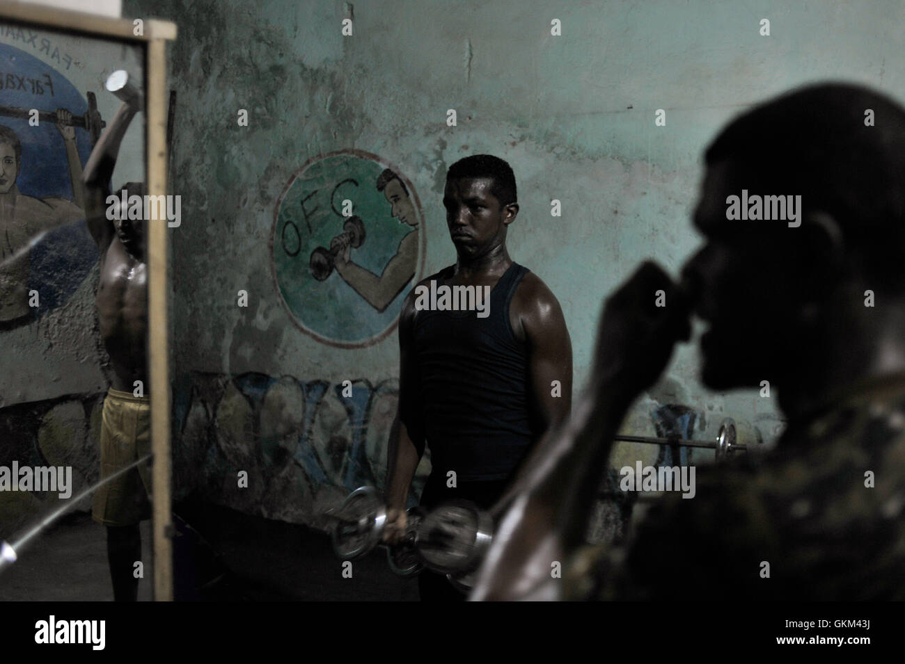 A weight lifter trains at a gym in the Hamar Weyne district of ...