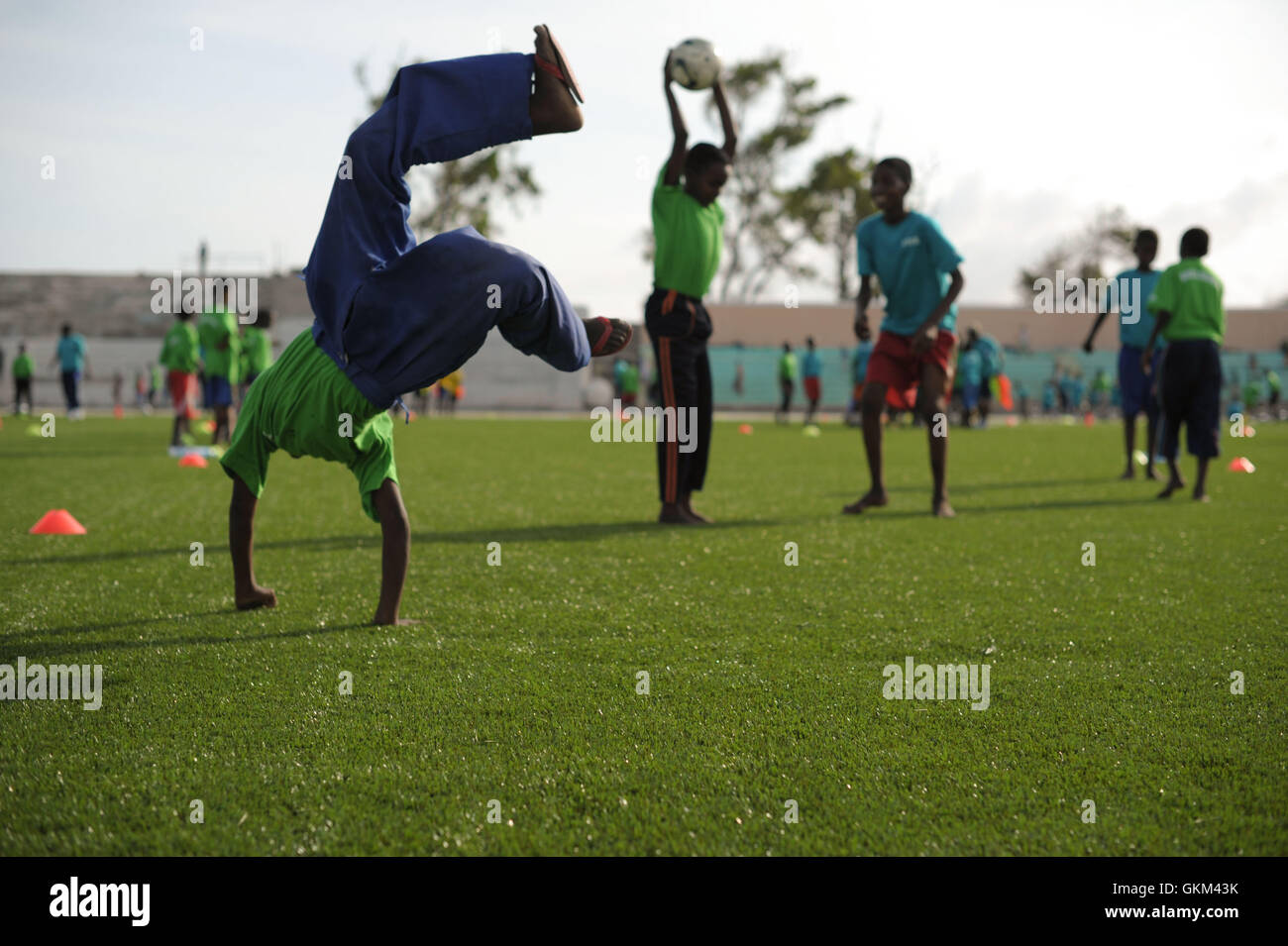 Children enjoy playing football at the FIFA Football Festival in ...