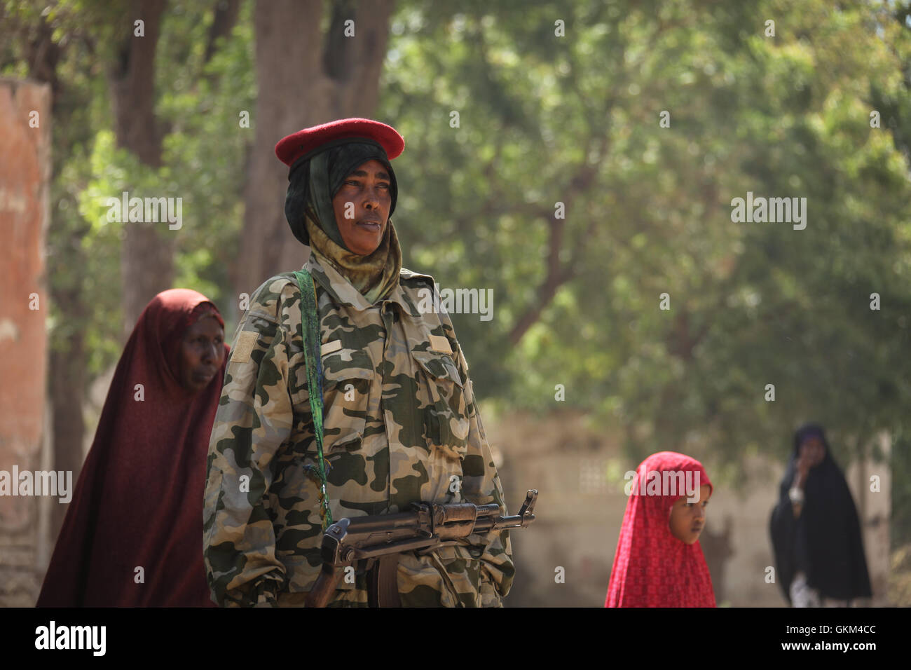 A female Somali National Army (SNA) soldier guards a checkpoint at Lama ...