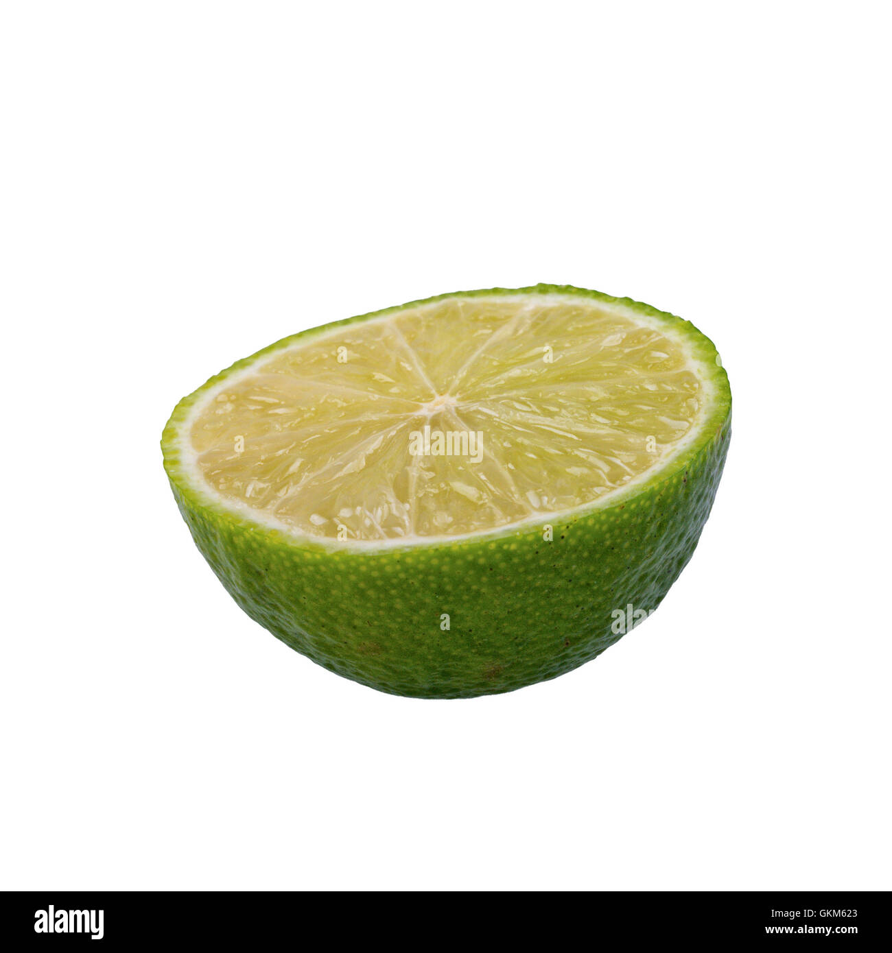 Cut lime isolated on a white background Stock Photo - Alamy