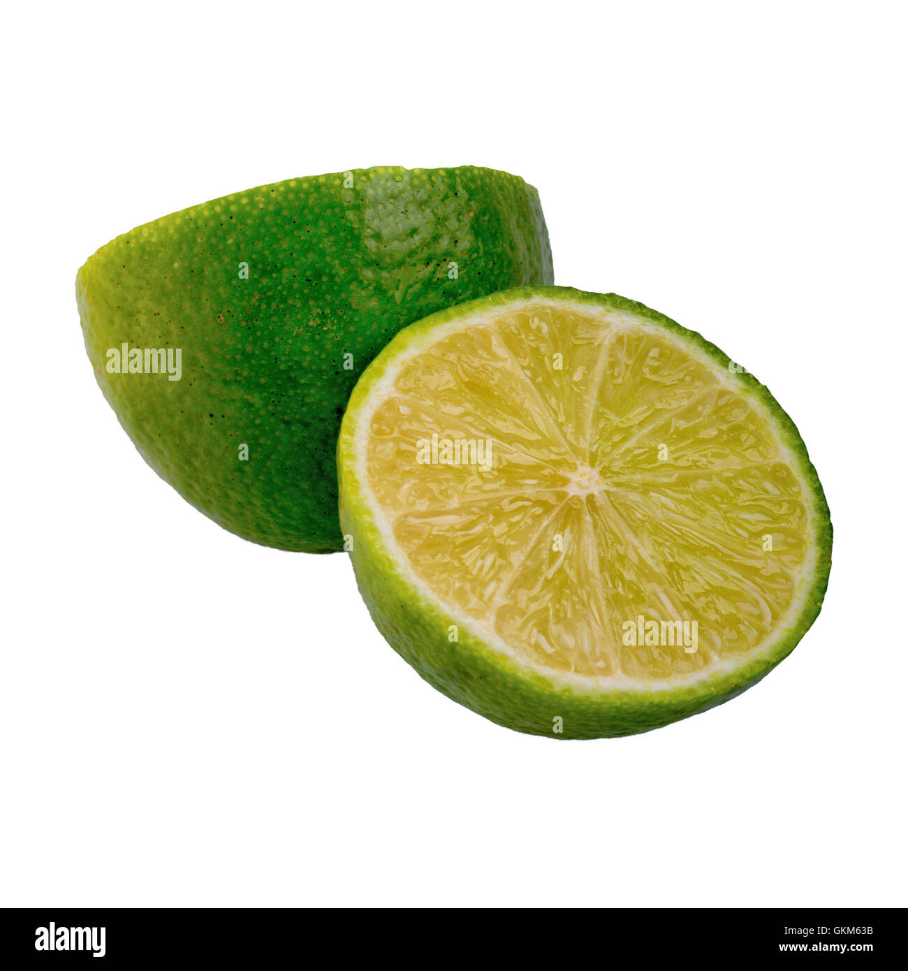 Cut lime isolated on a white background Stock Photo - Alamy