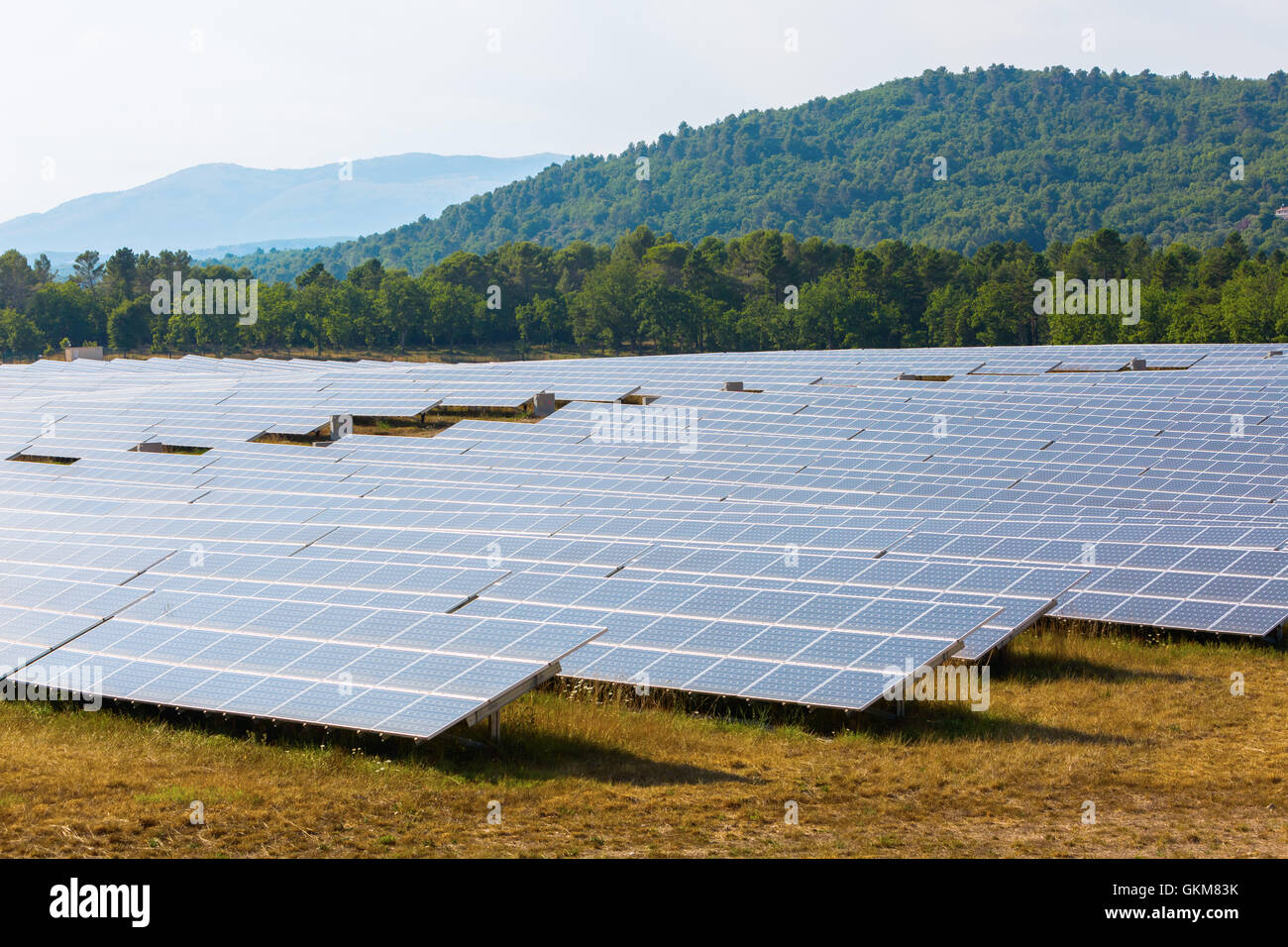 field with solar collectors in a landscape Stock Photo - Alamy