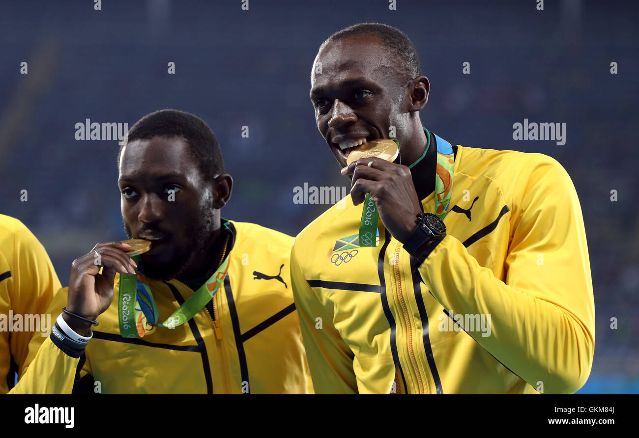 Jamaica's Usain Bolt (right) and Nickel Ashmeade are presented with ...