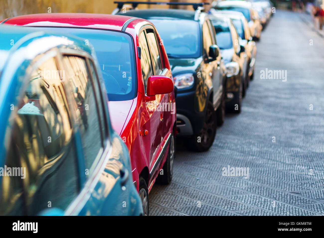 row of cars parked along the road Stock Photo - Alamy