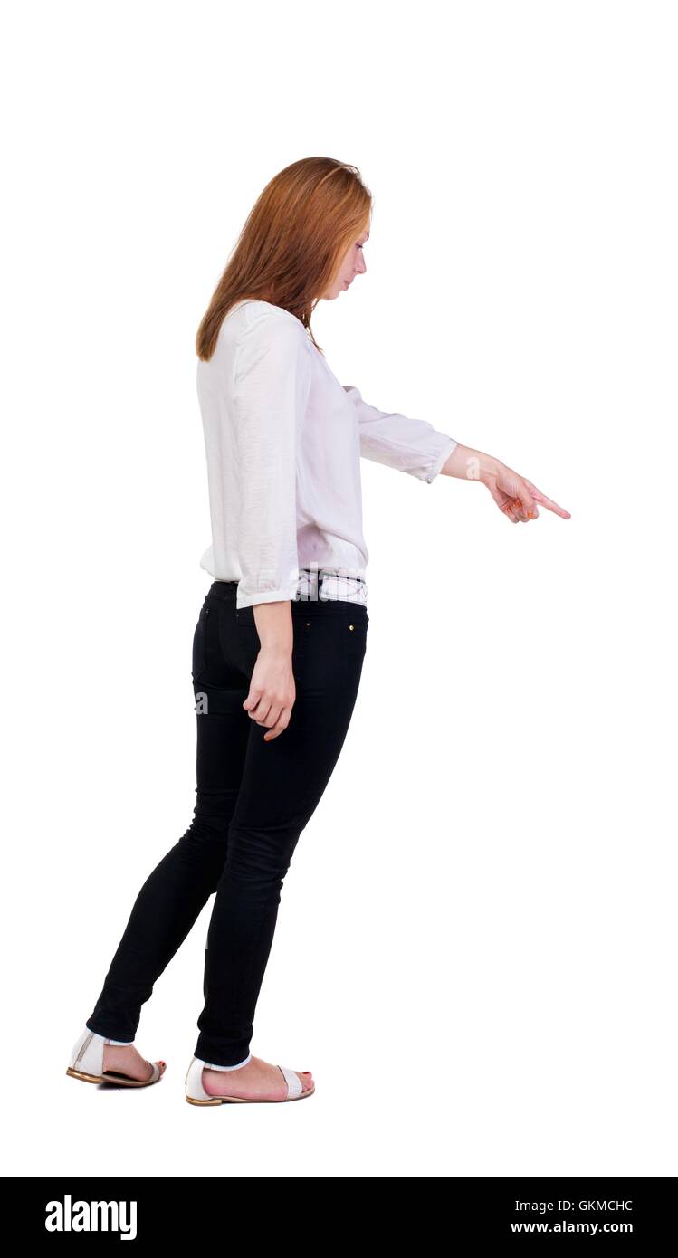 Back view of pointing woman Stock Photo - Alamy