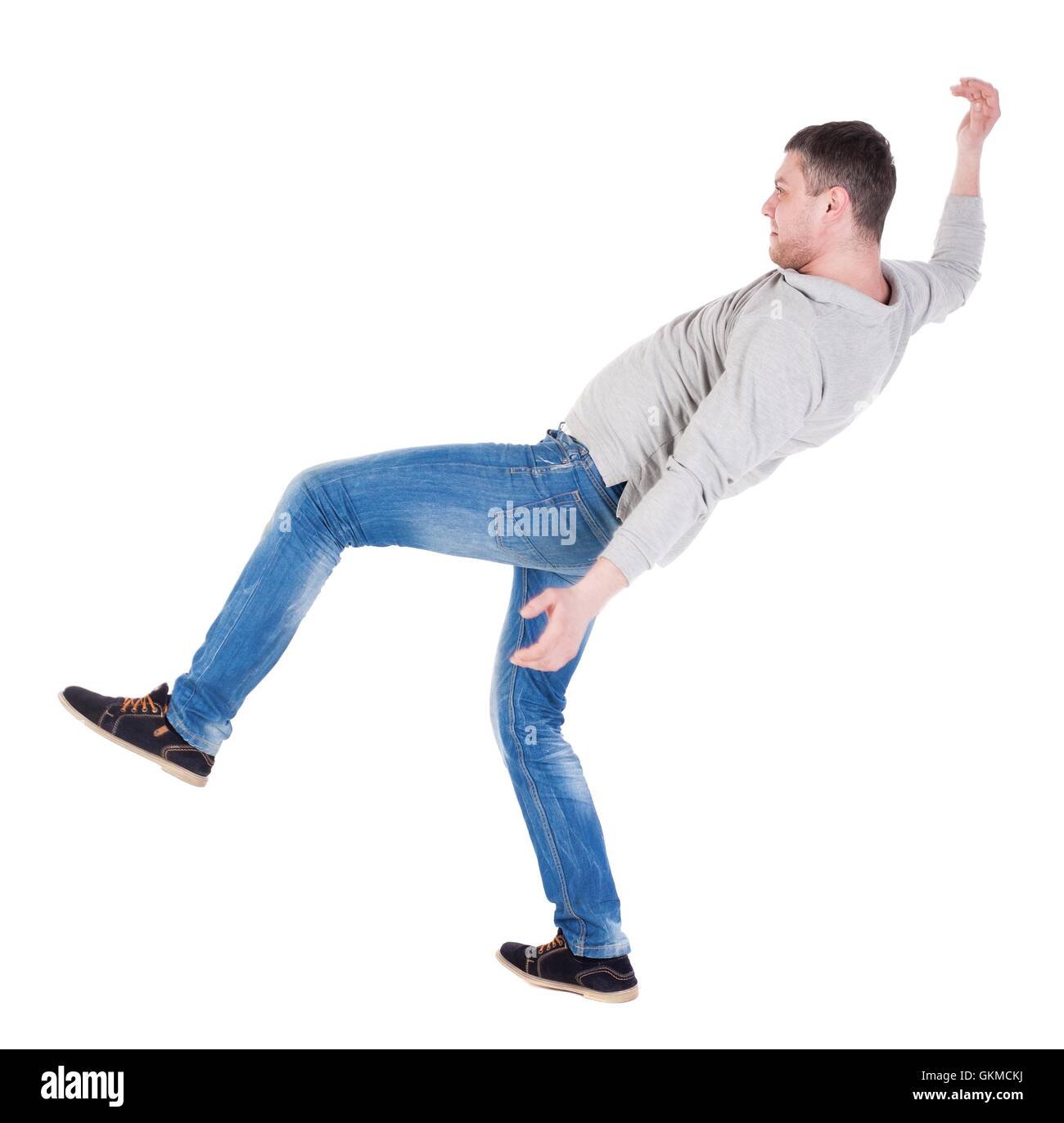 Back view man Balances waving his arms Stock Photo - Alamy