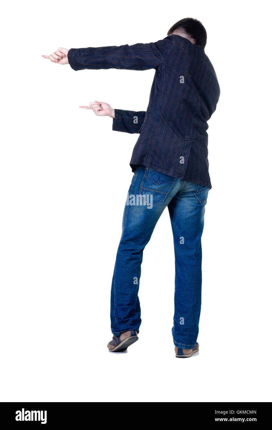 young man pointing at wall. rear view Stock Photo - Alamy