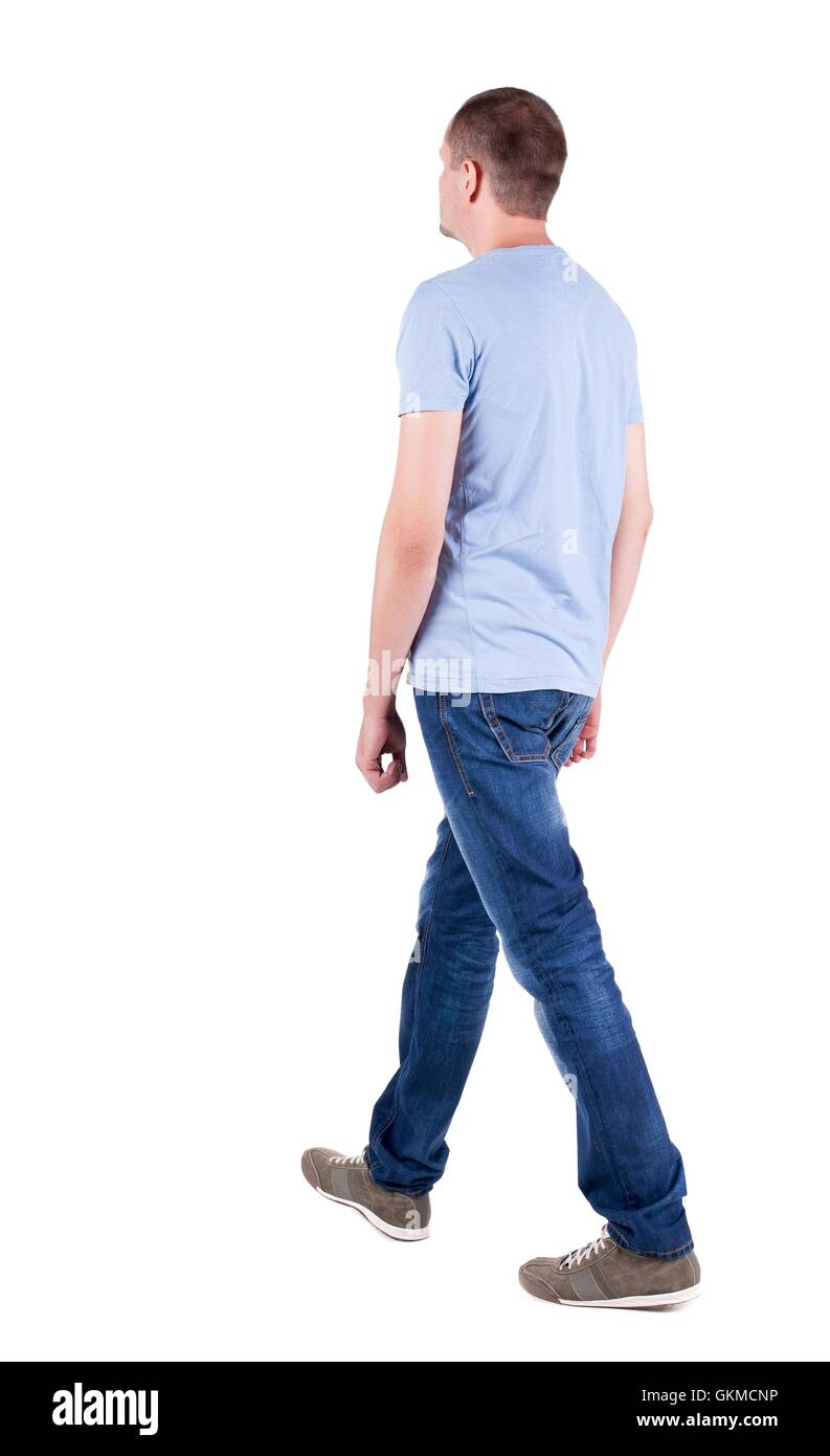 Back view of going handsome man in jeans Stock Photo - Alamy