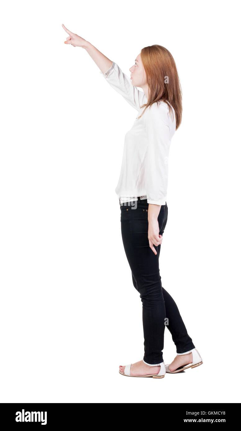 Back view of pointing woman Stock Photo - Alamy