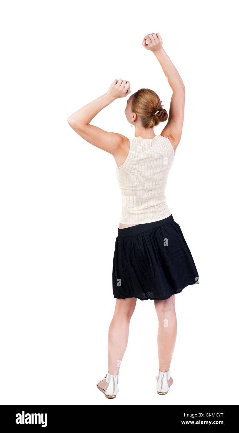 Back view of joyful woman celebrating victory hands up Stock Photo - Alamy