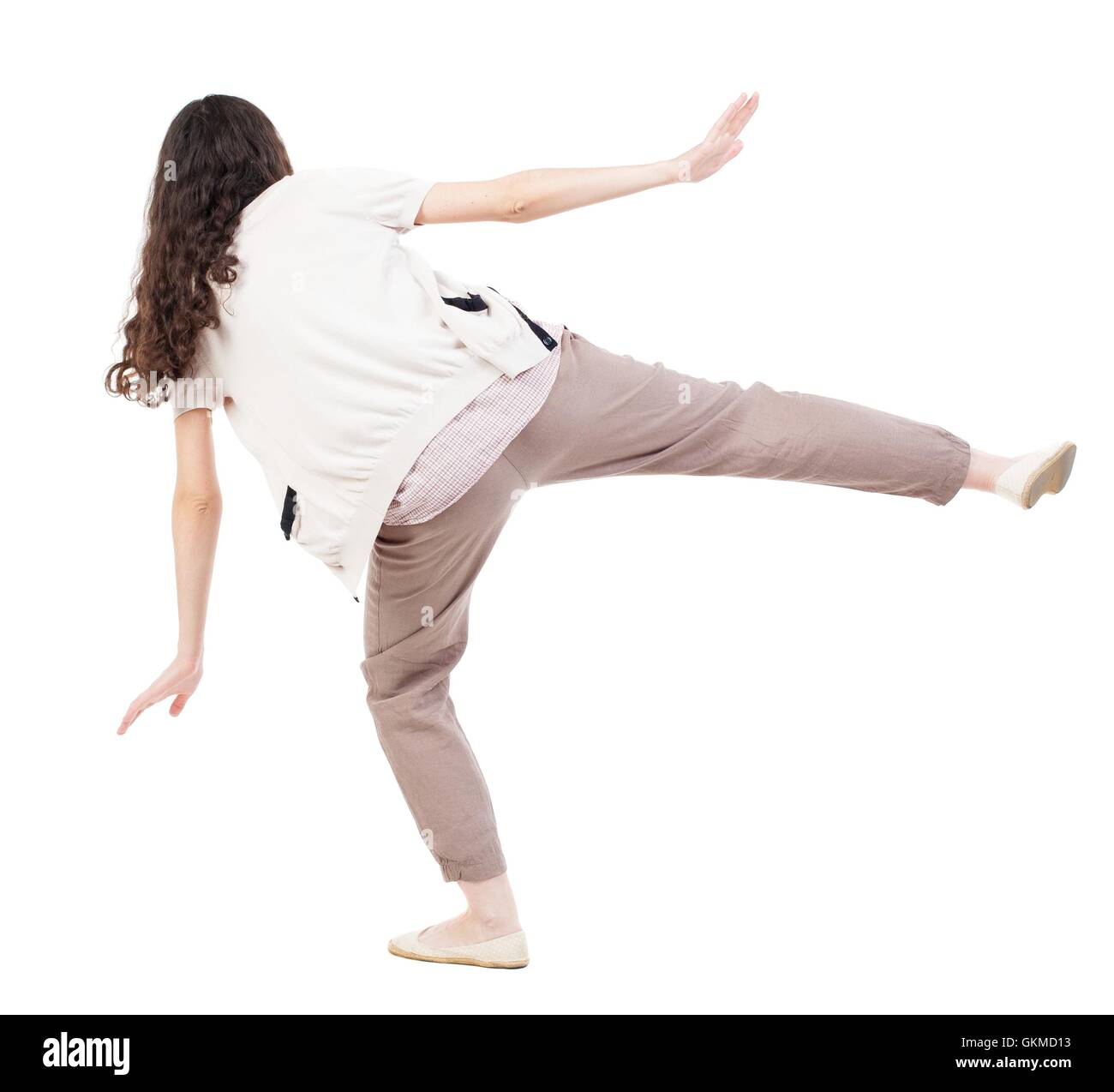 Back view curly woman Balances waving his arms Stock Photo - Alamy