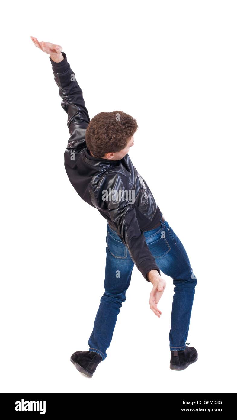 Balancing young man or dodge falling man Stock Photo - Alamy