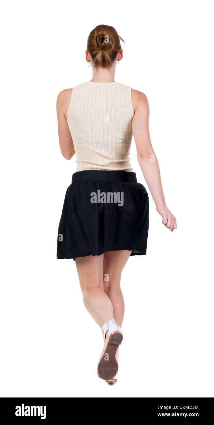 back view of running woman in dress Stock Photo - Alamy