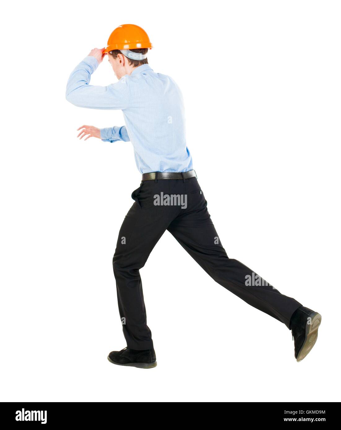 Back view of running engineer in helmet. Walking guy in motion Stock ...