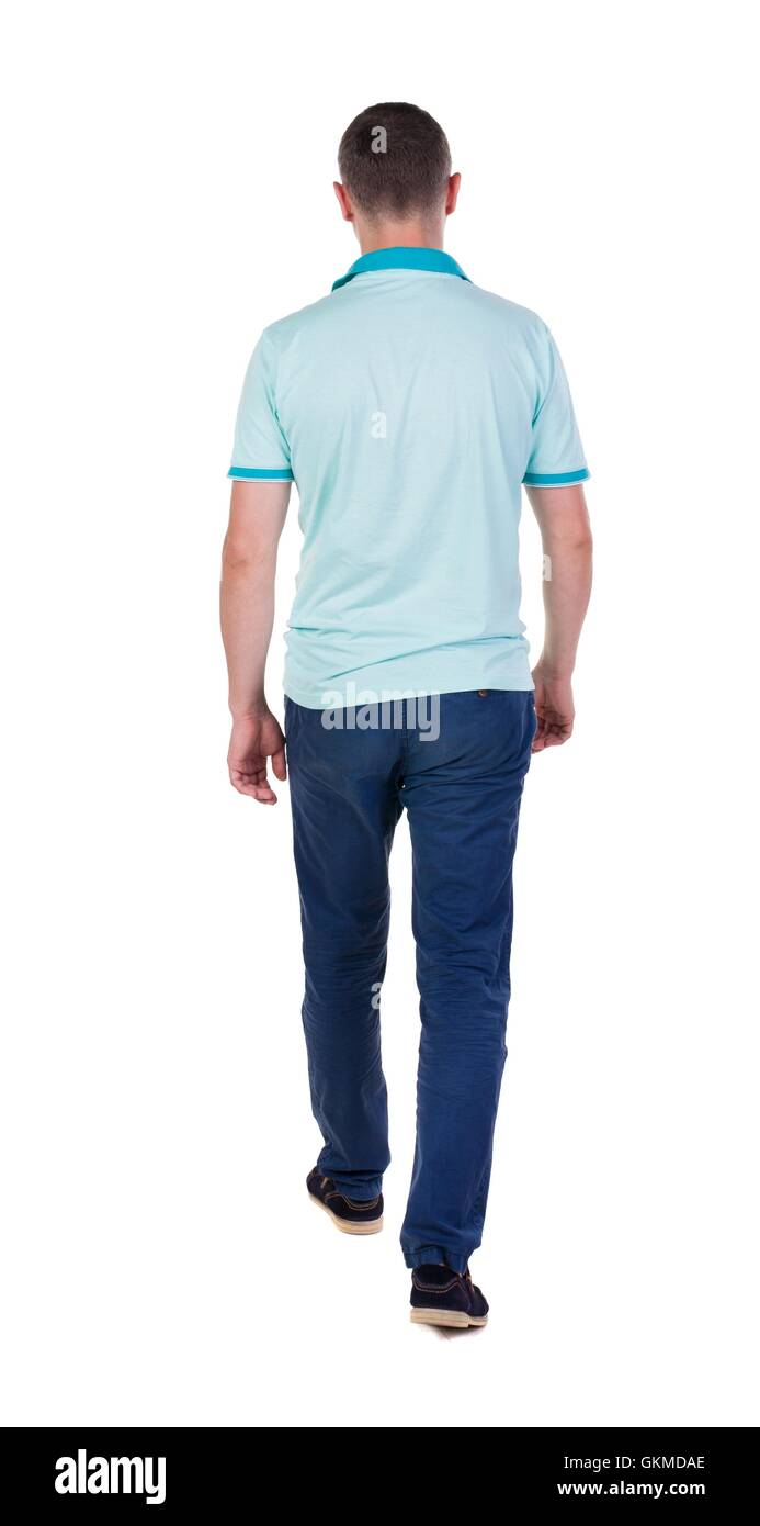 Back view of going handsome man in jeans and a shirt Stock Photo - Alamy