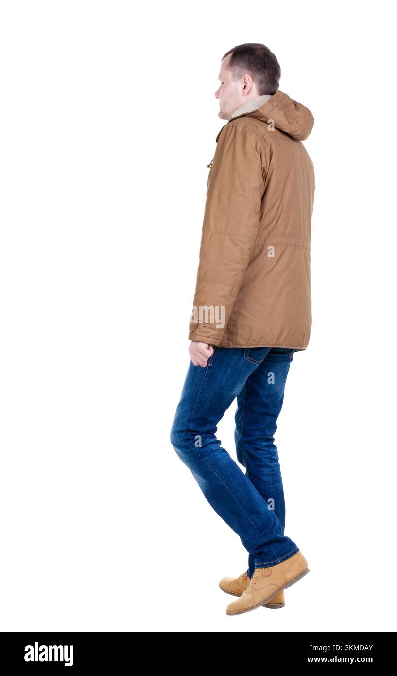 Back view of going handsome man in jeans and jacket Stock Photo - Alamy