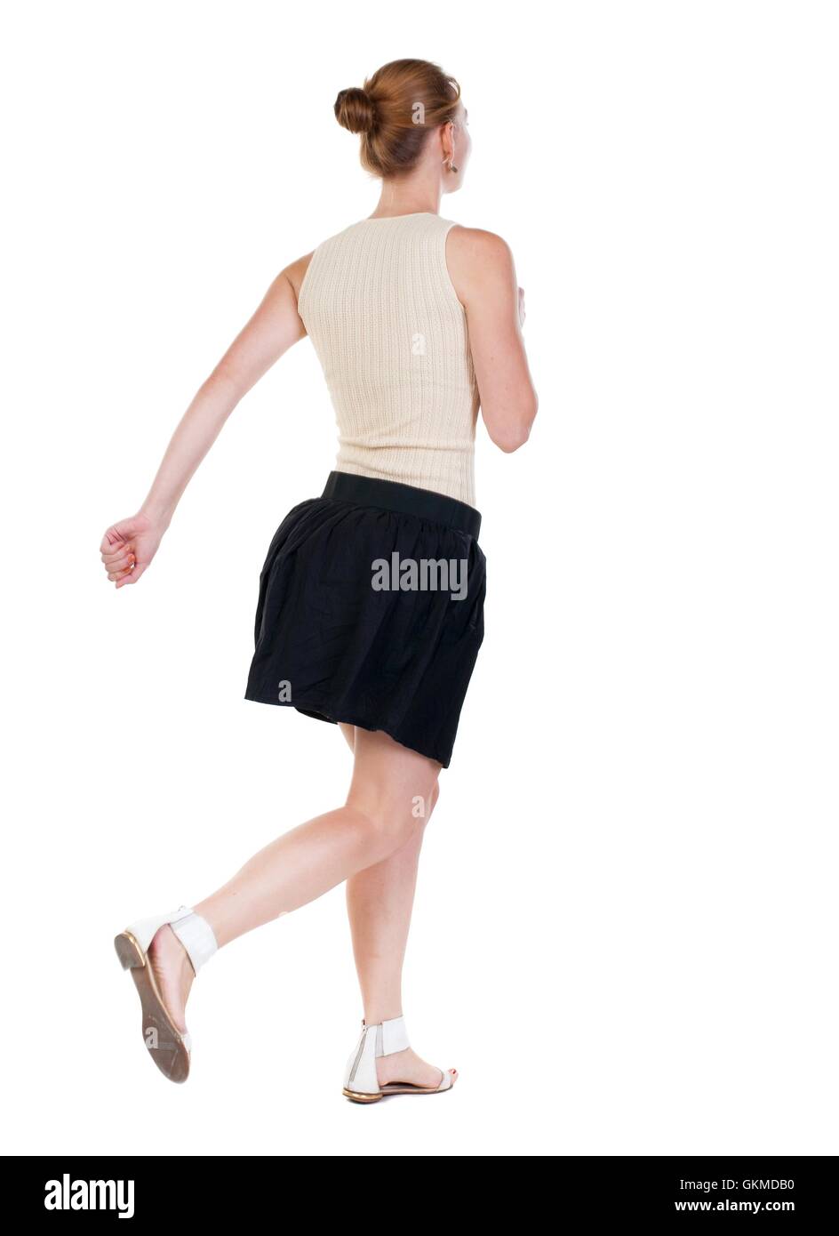 back view of running woman in dress Stock Photo - Alamy