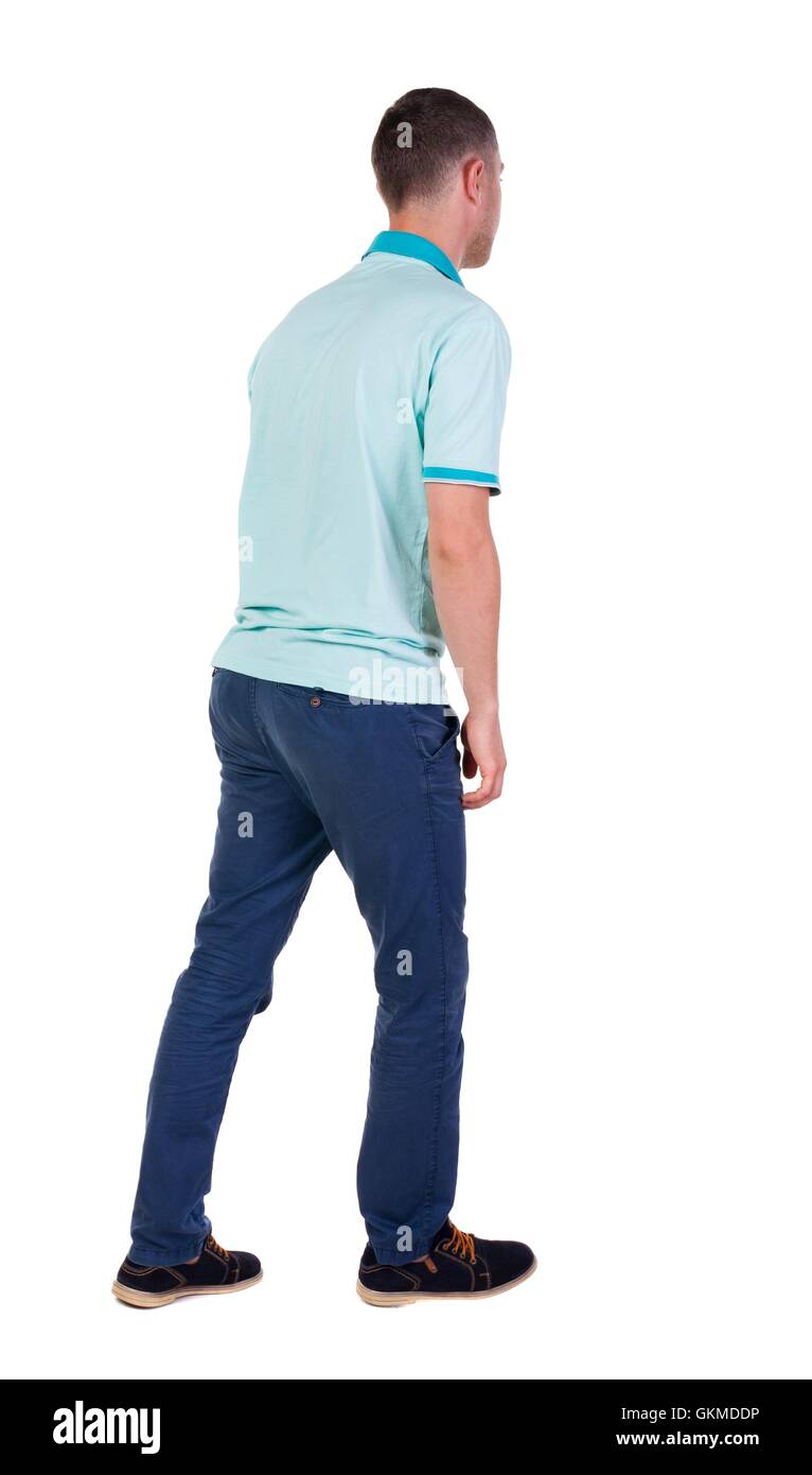 Back view of going handsome man in jeans and a shirt Stock Photo - Alamy