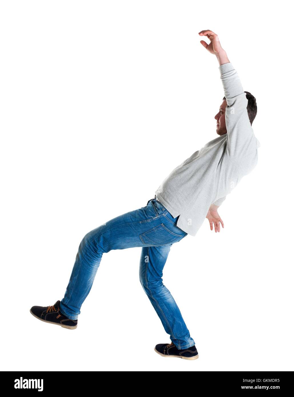 Back view man Balances waving his arms Stock Photo - Alamy