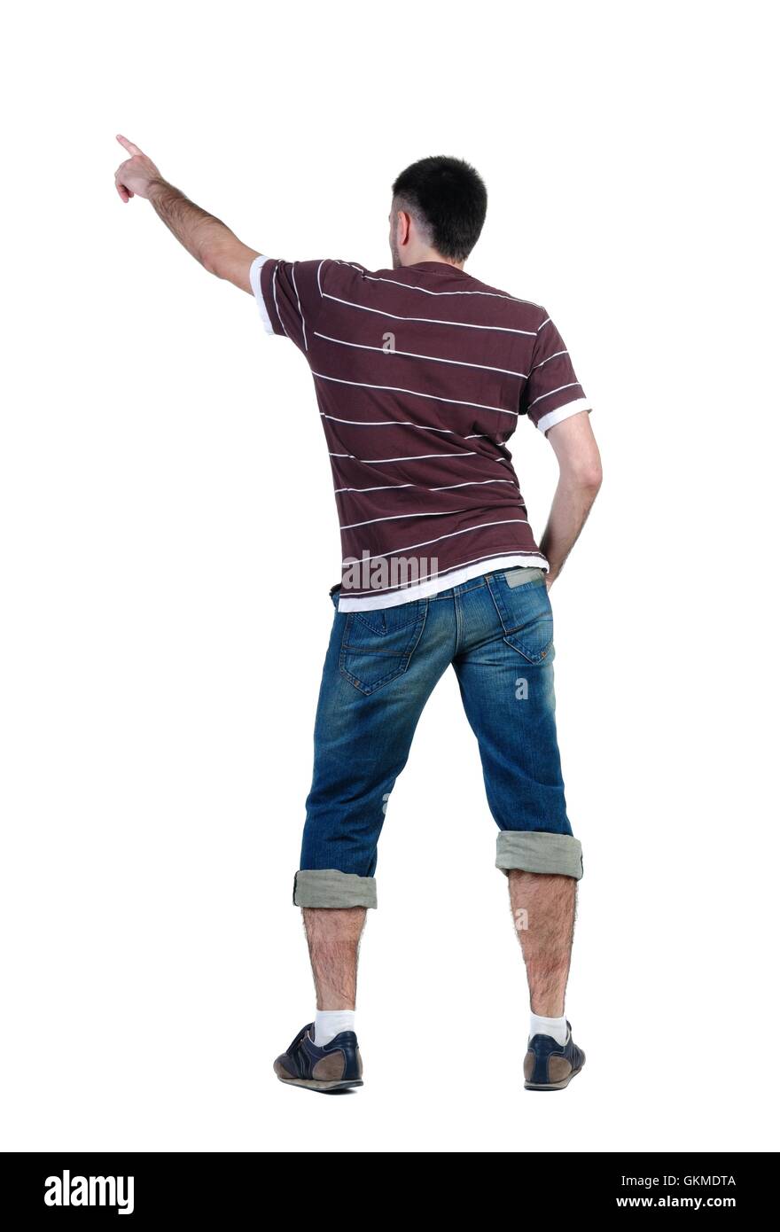 young man pointing at wall. rear view Stock Photo - Alamy