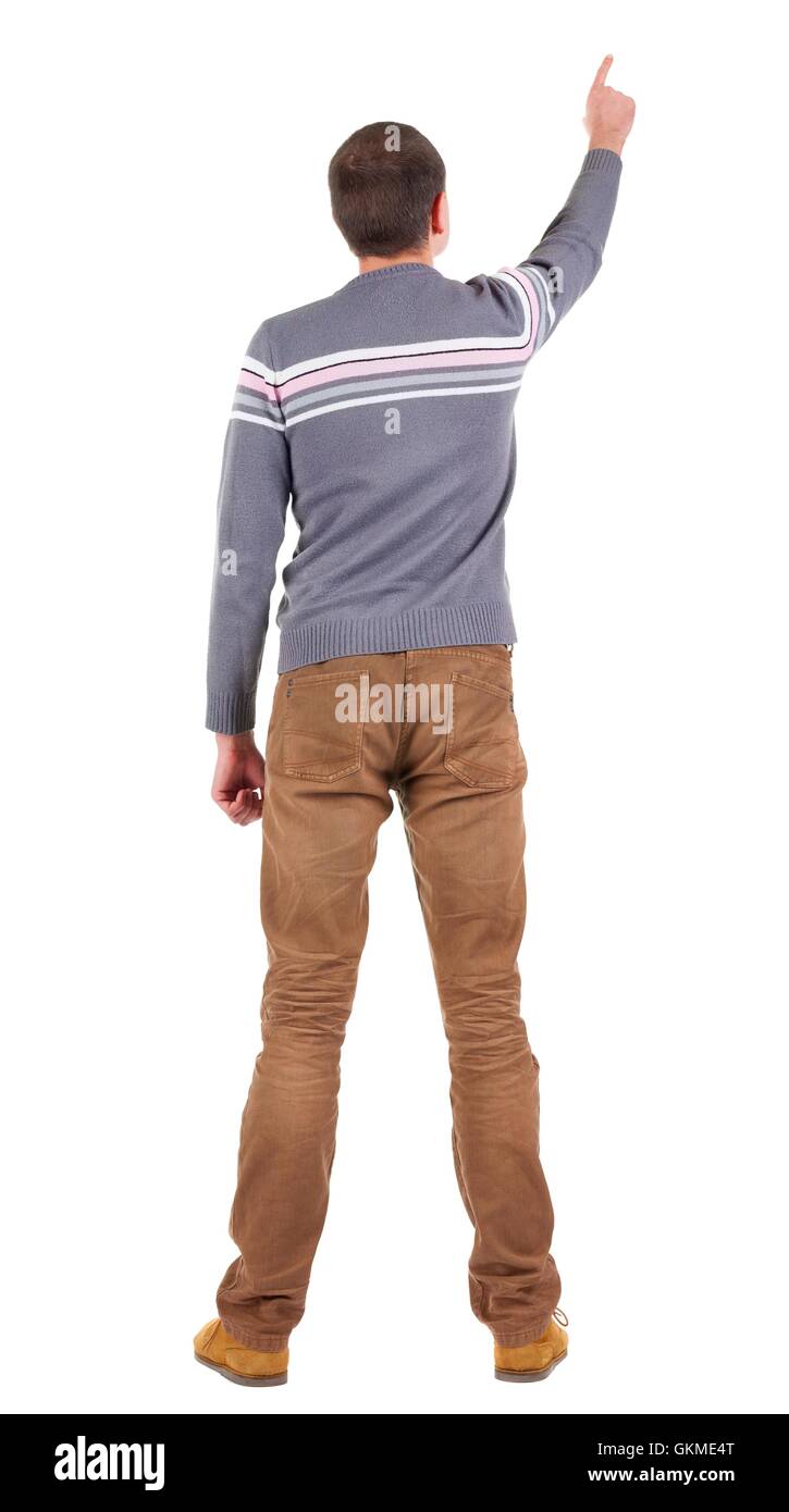 Back view of pointing young men in sweater and jeans Stock Photo - Alamy