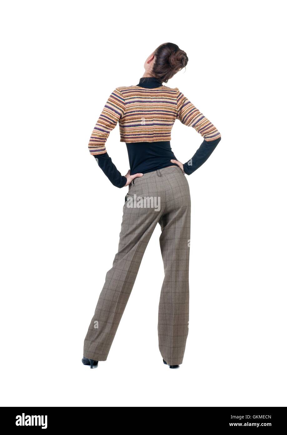 Beautiful woman standing front wall Cut Out Stock Images & Pictures - Alamy