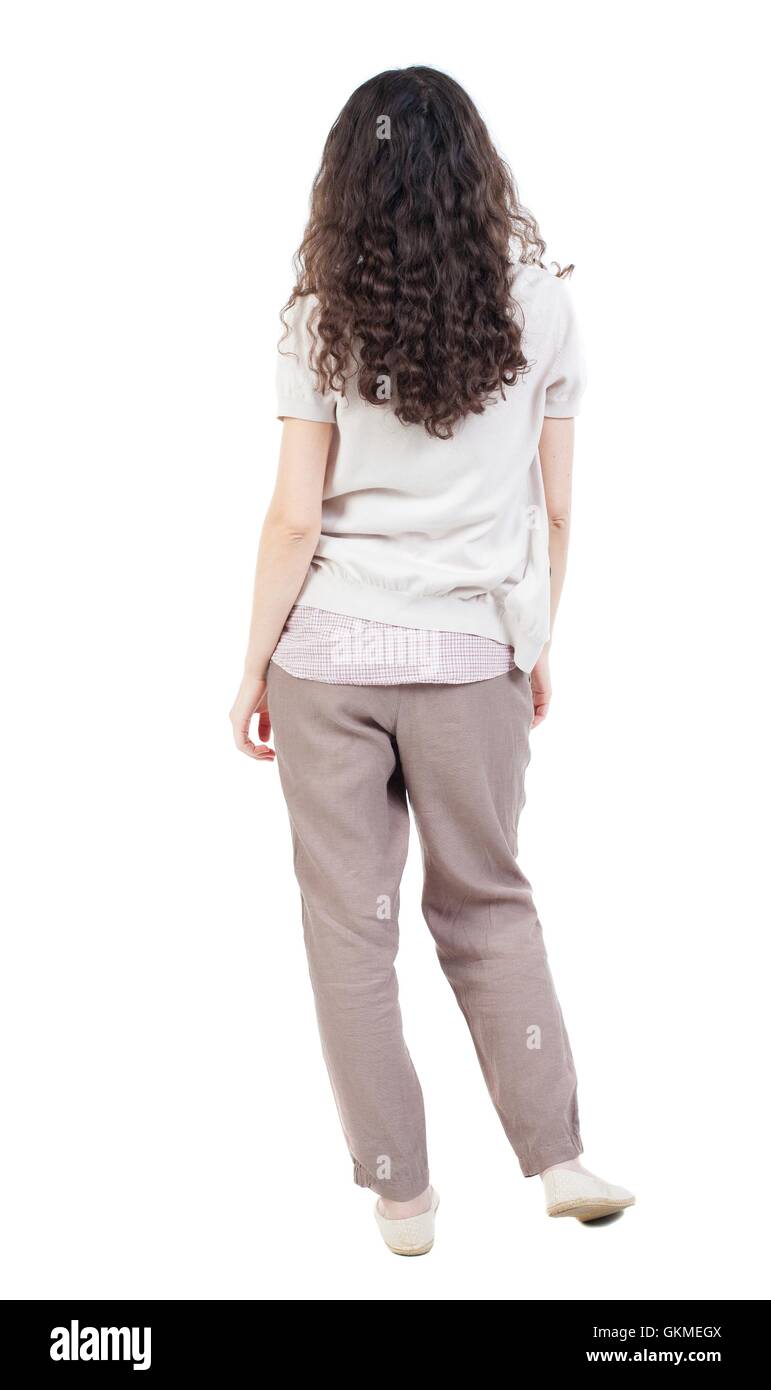 back view of standing young beautiful woman. girl watching Stock Photo ...